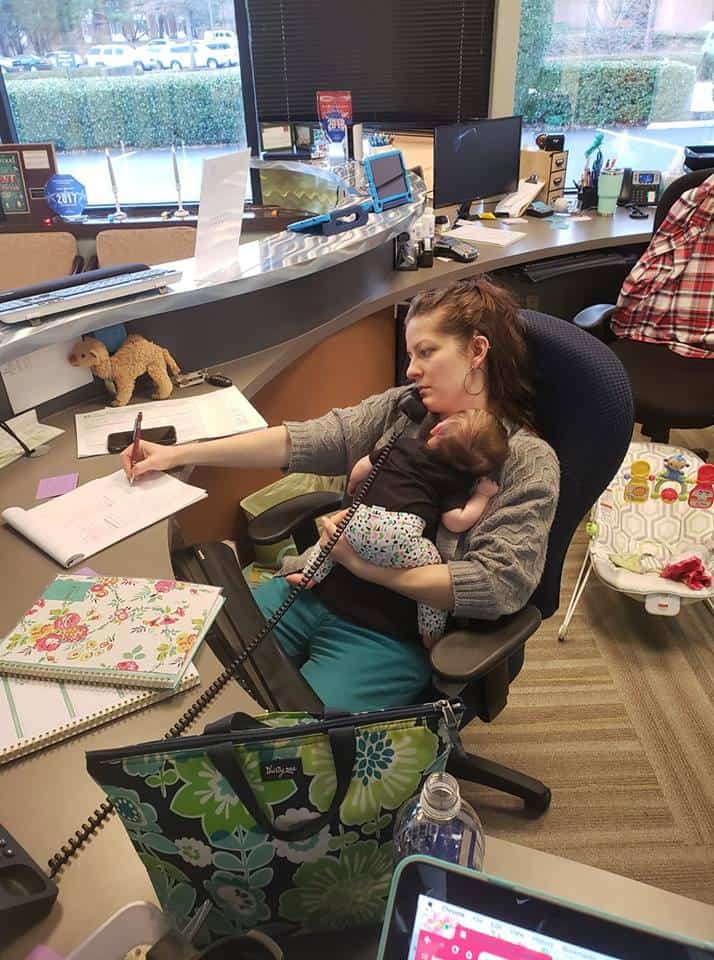 Photo of multitasking mom caring for infant at work goes viral