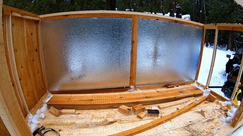 Two men build cozy snowmobile camper from scratch