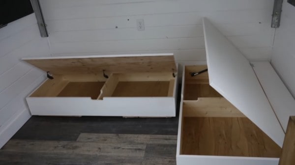 Open-concept modern tiny house customized with an elevator bed