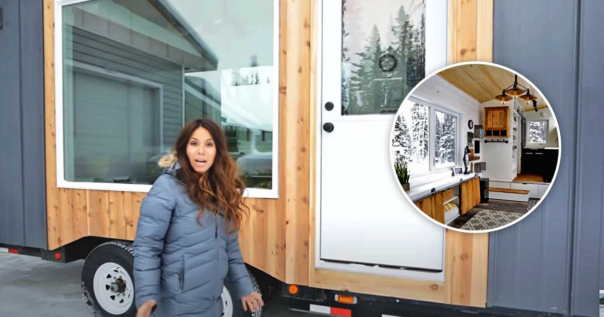 Open-concept modern tiny house customized with an elevator bed