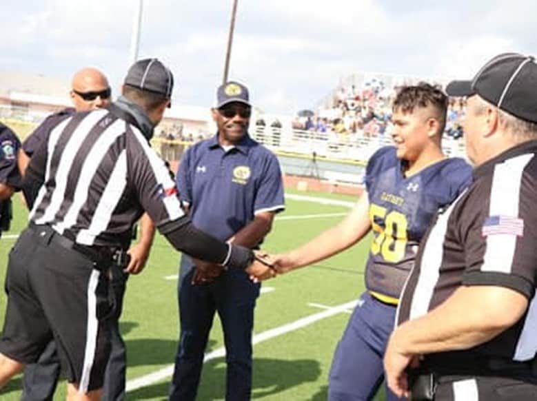 Police officers attend first football game of the son of fallen corporal