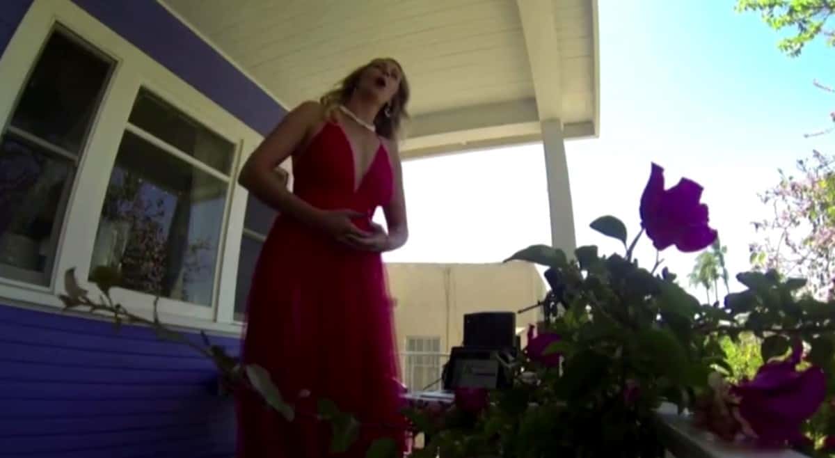 Opera singer stages concert on front porch as people watch in awe while ...