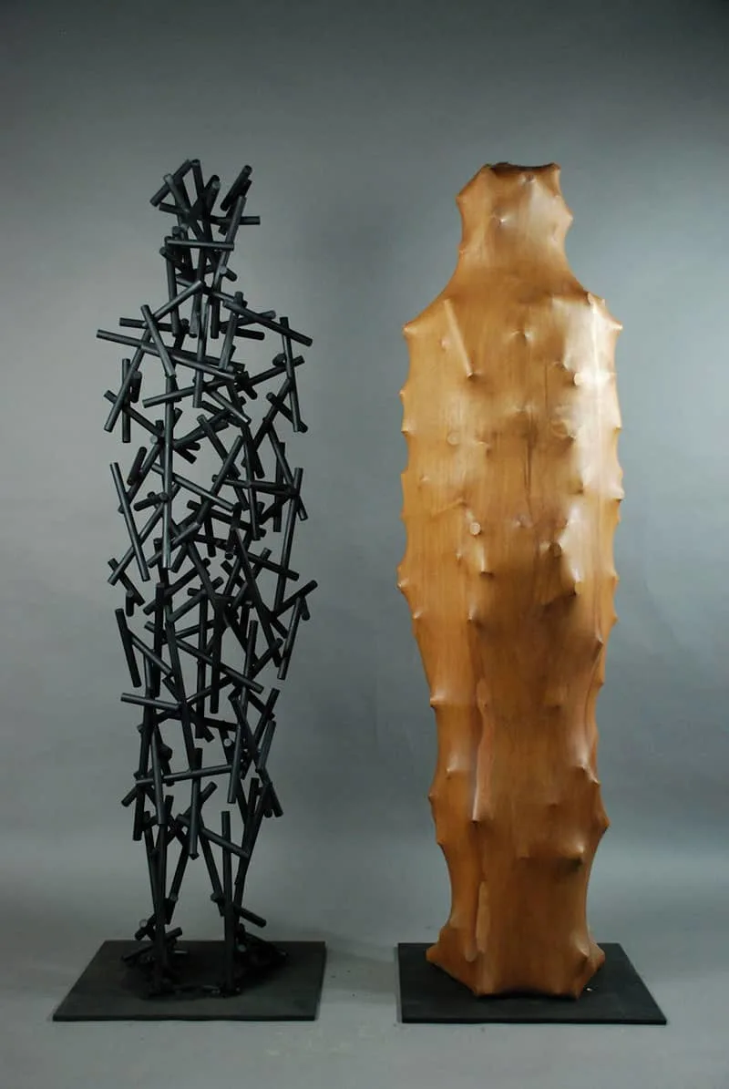 Artist creates wood sculptures that look like figures are trapped ...