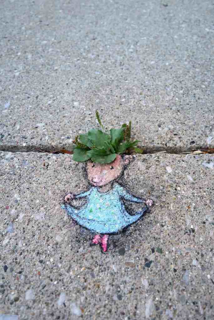Artist brings Michigan's streets to life with his whimsical chalk drawings