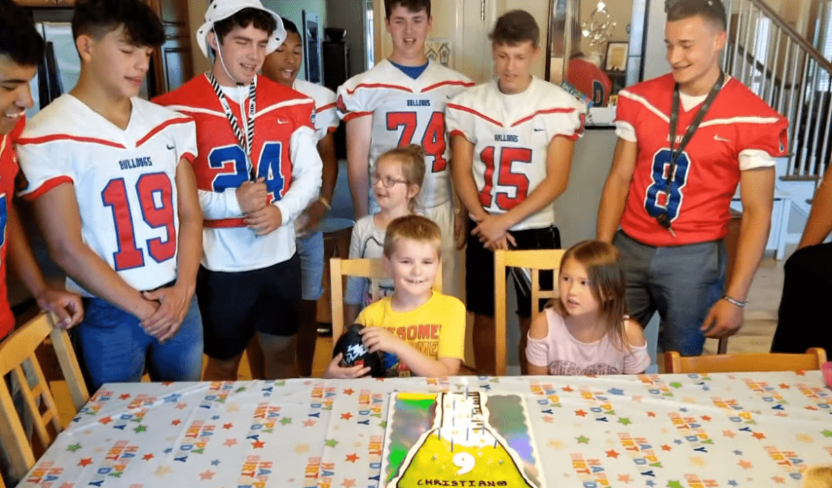 Teen football players show up to celebrate autistic boy's birthday