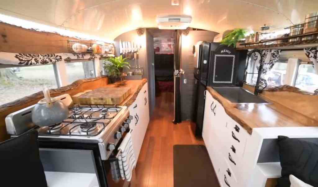 Man Turns Bus Into Tiny Home With Chef-Styled Kitchen Design