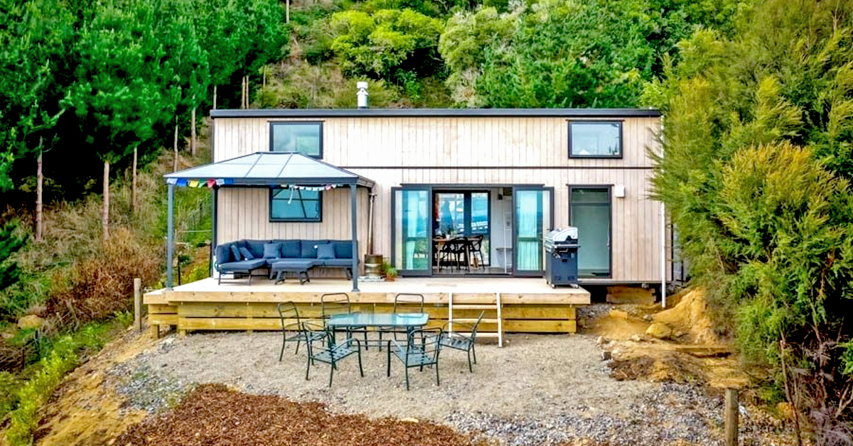 Take a look inside ultra-spacious tiny home with a loft where even tall ...