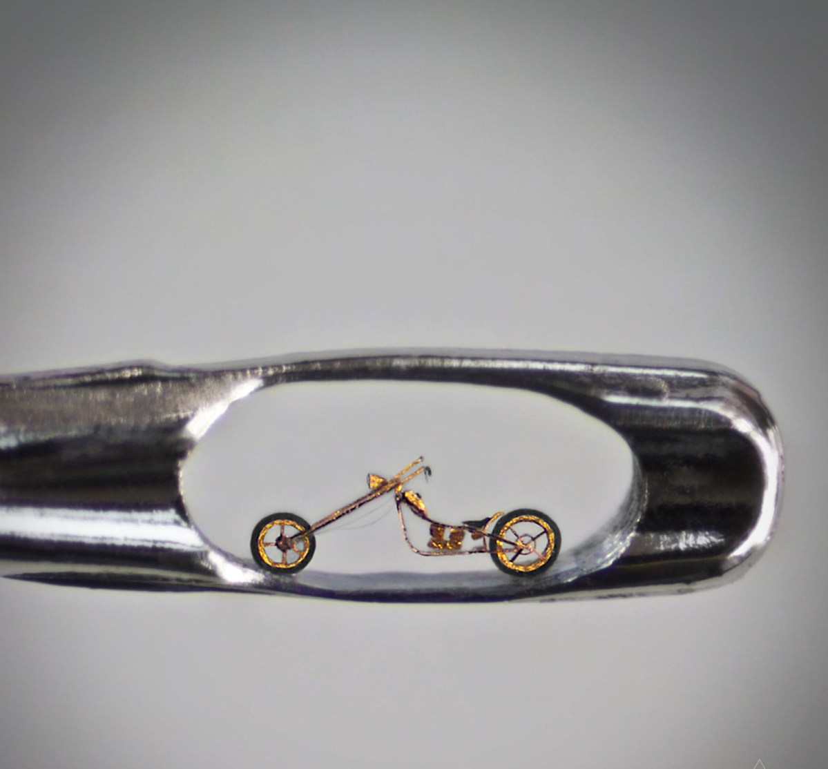 The tiniest handmade sculptures that fit in the eye of a needle