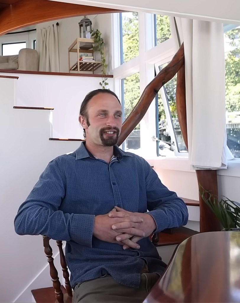 Couple transforms derelict boat into stunning tiny boat house