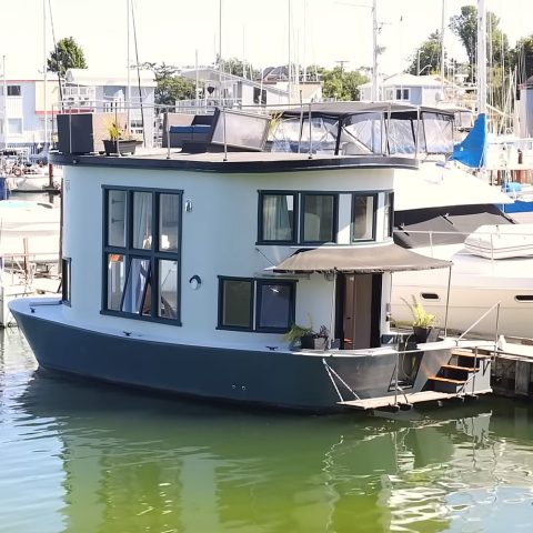 Couple transforms derelict boat into stunning tiny boat house