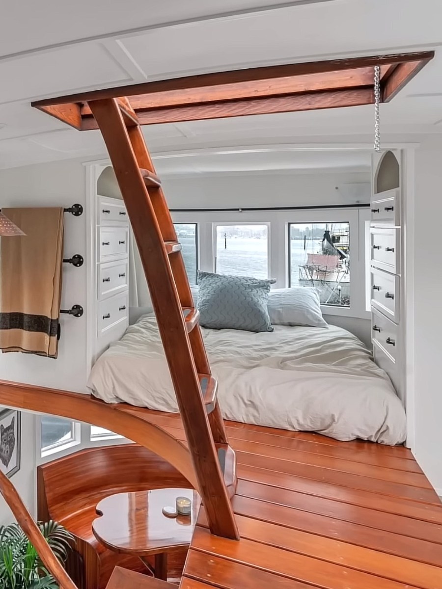 Couple transforms derelict boat into stunning tiny boat house