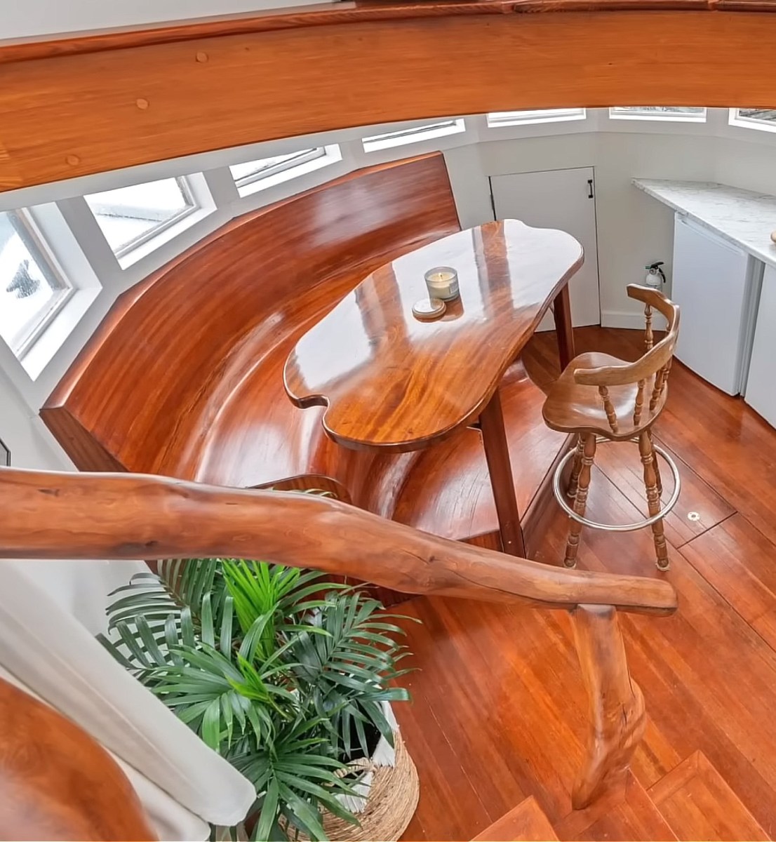 Couple transforms derelict boat into stunning tiny boat house