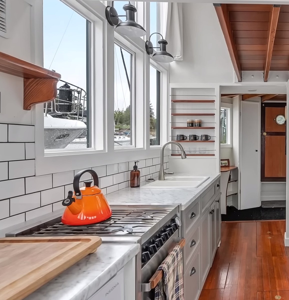 Couple transforms derelict boat into stunning tiny boat house