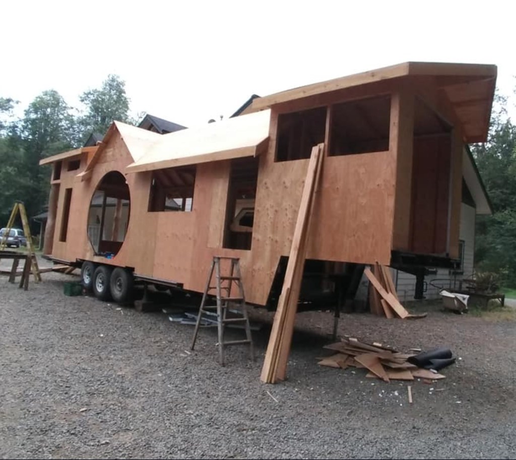 Man builds whimsical tiny home by hand using recycled materials