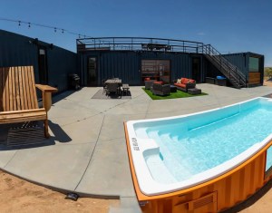 Man builds home made from shipping containers with a pool