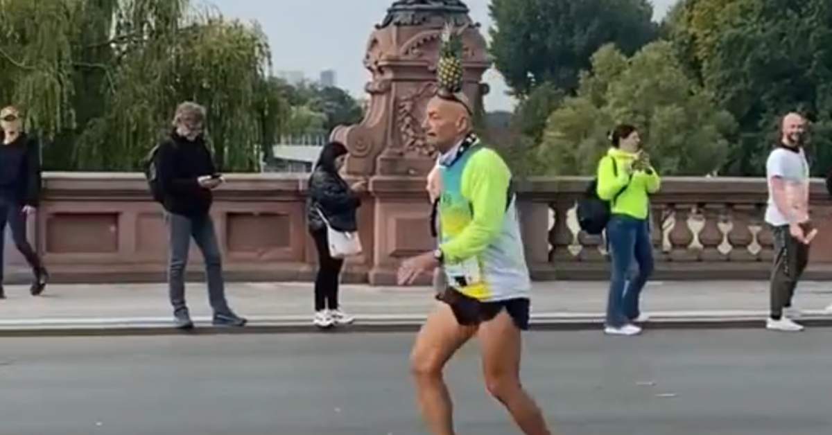 Man runs with a pineapple on his head to share powerful message