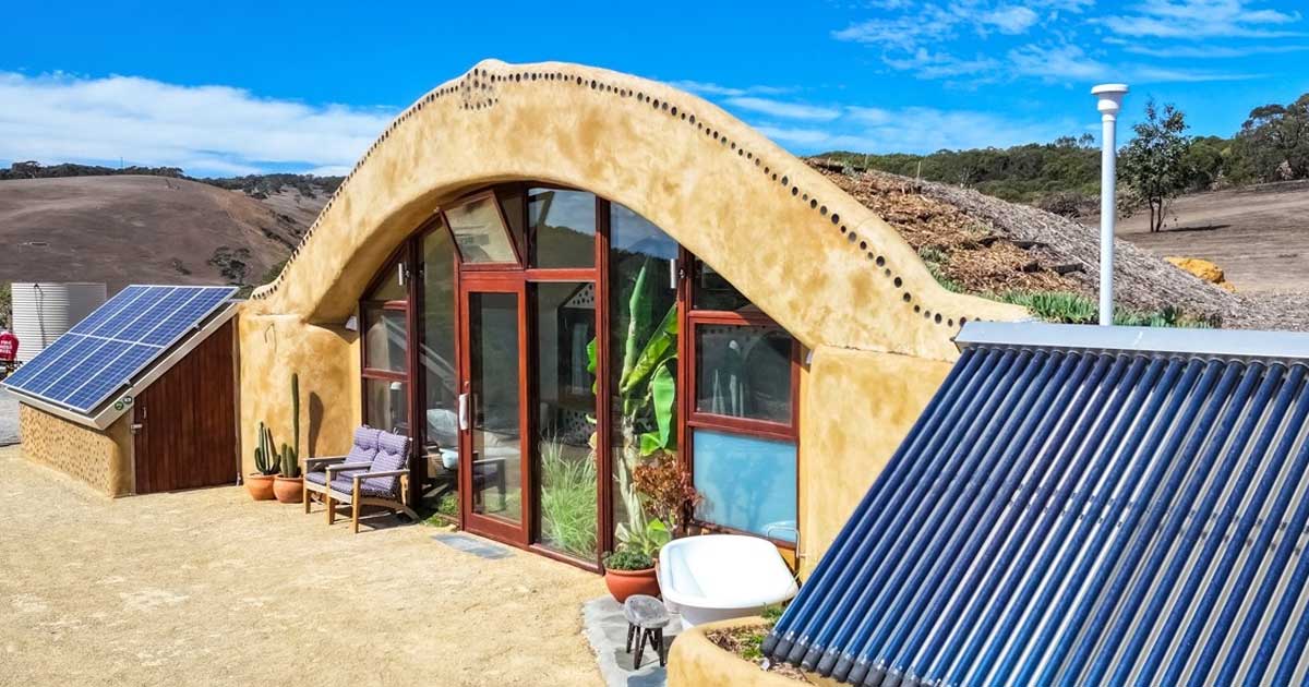 Man builds Earthship using car tires and glass bottles